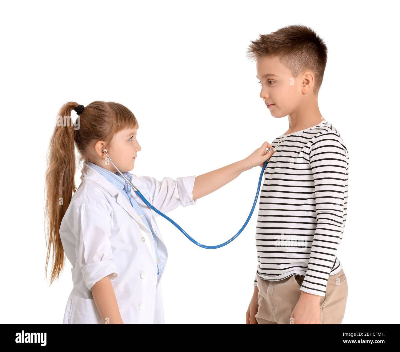 Cute little doctor with patient on white background Stock Photo - Alamy