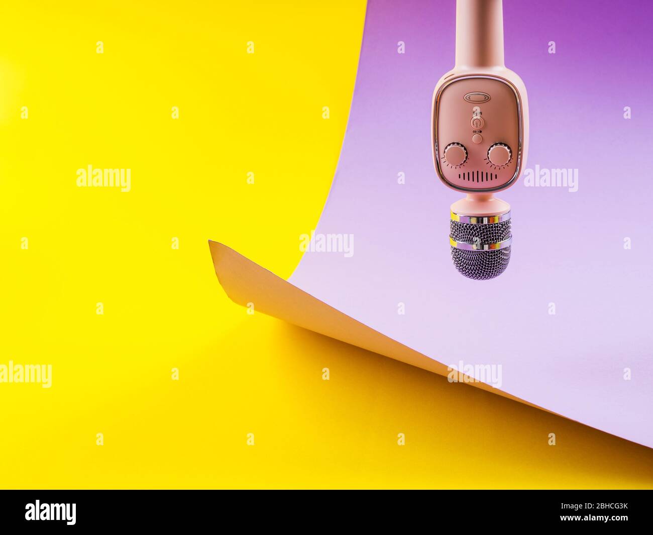 Pastel pink microphone on colorful background Stock Photo - Alamy