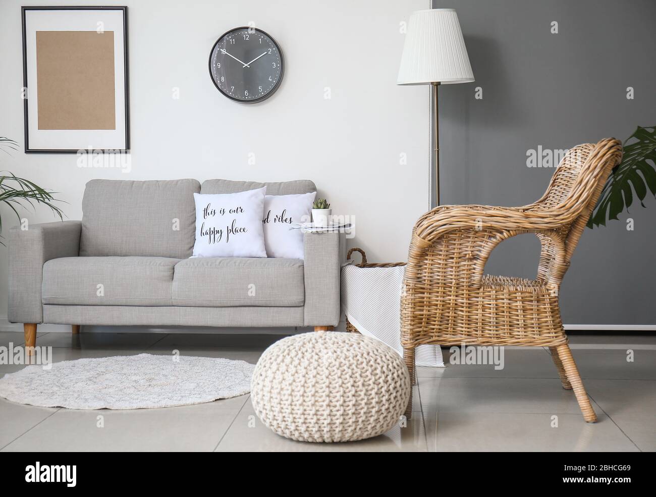 Interior of modern room with comfortable armchair and sofa Stock Photo ...