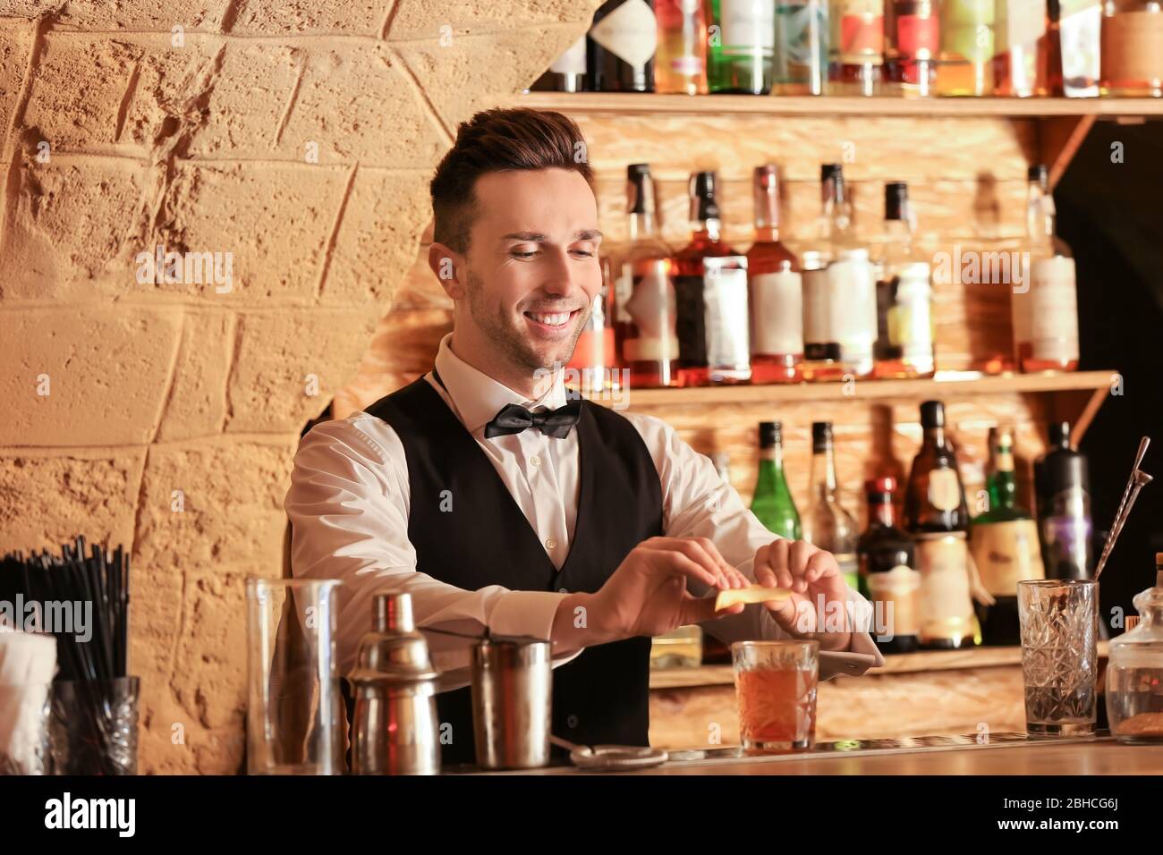 Male bartender making cocktail in pub Stock Photo - Alamy