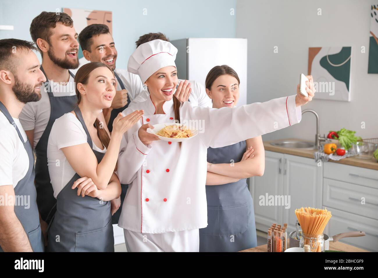 Group people taking cooking hi-res stock photography and images - Alamy
