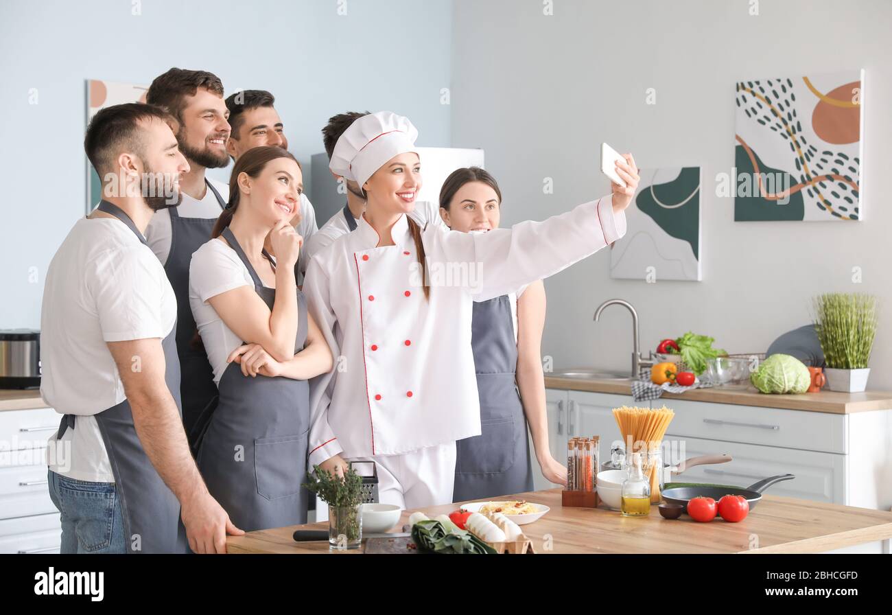 Group people taking cooking hi-res stock photography and images - Alamy
