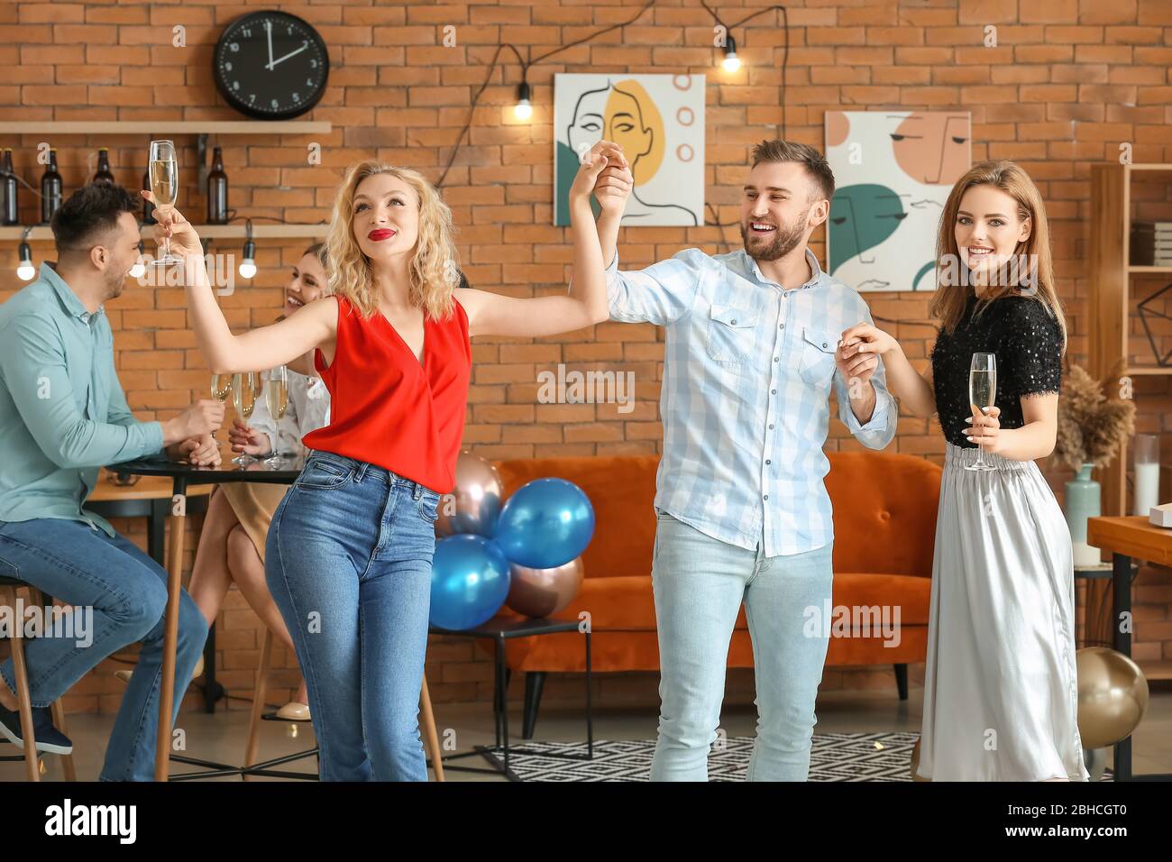 Young people having party at home Stock Photo - Alamy