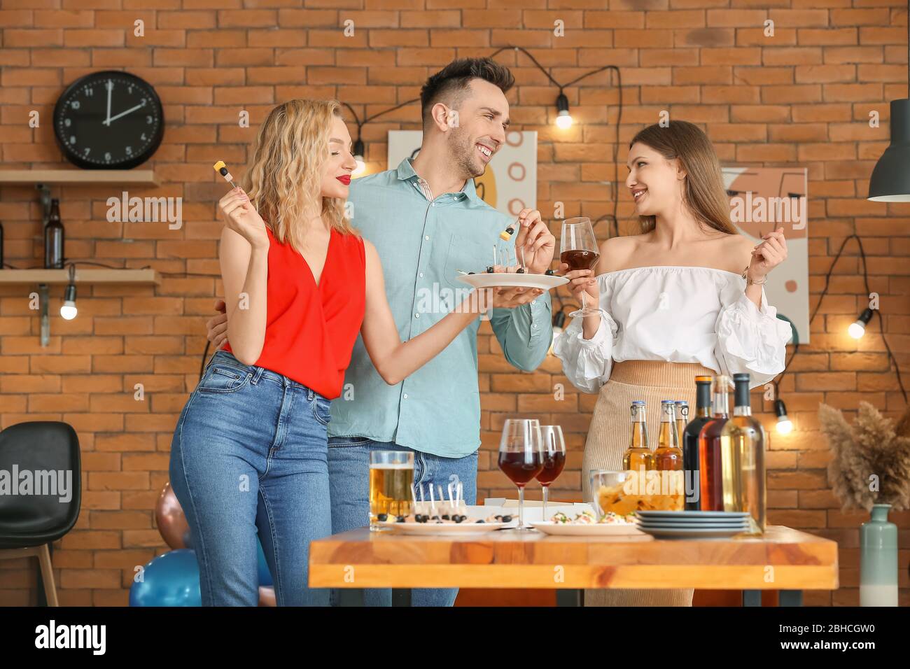Young people having party at home Stock Photo - Alamy