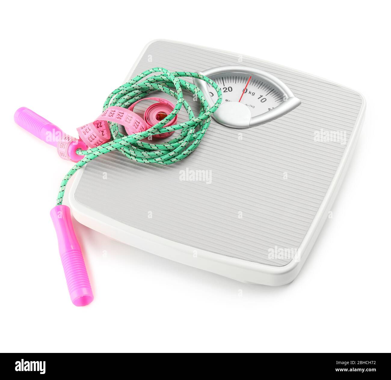 Weight scales with jumping rope on white background. Slimming concept ...