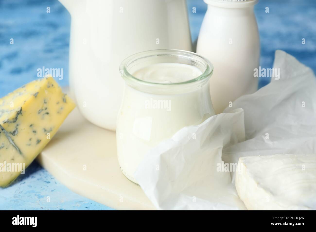 Different dairy products on table Stock Photo - Alamy