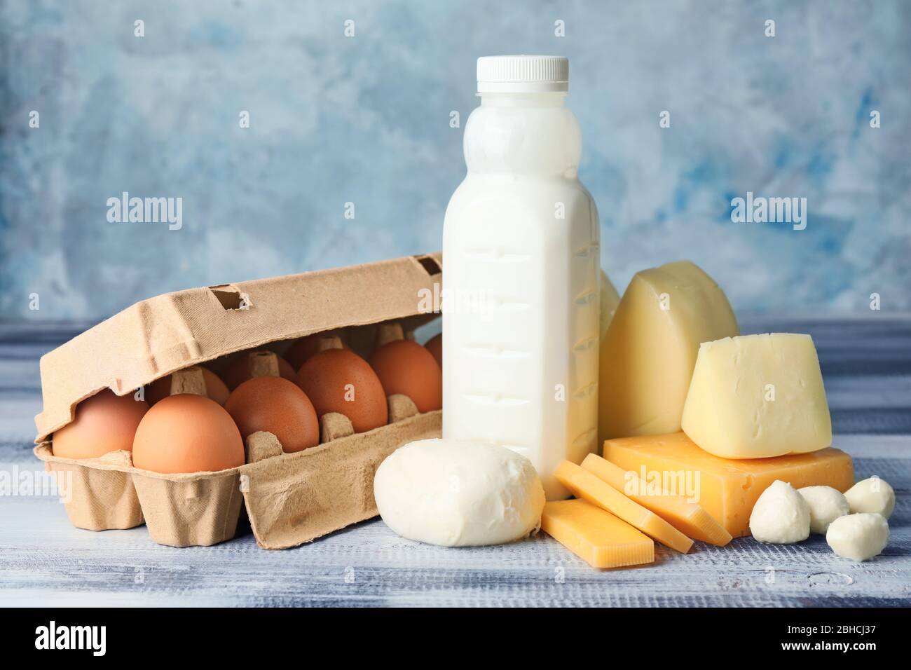 Different dairy products on wooden table Stock Photo - Alamy