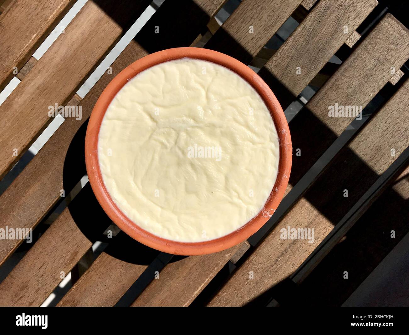 Homemade Yogurt / Yoghurt in Clay Pot on Wooden Table. Organic Healthy ...
