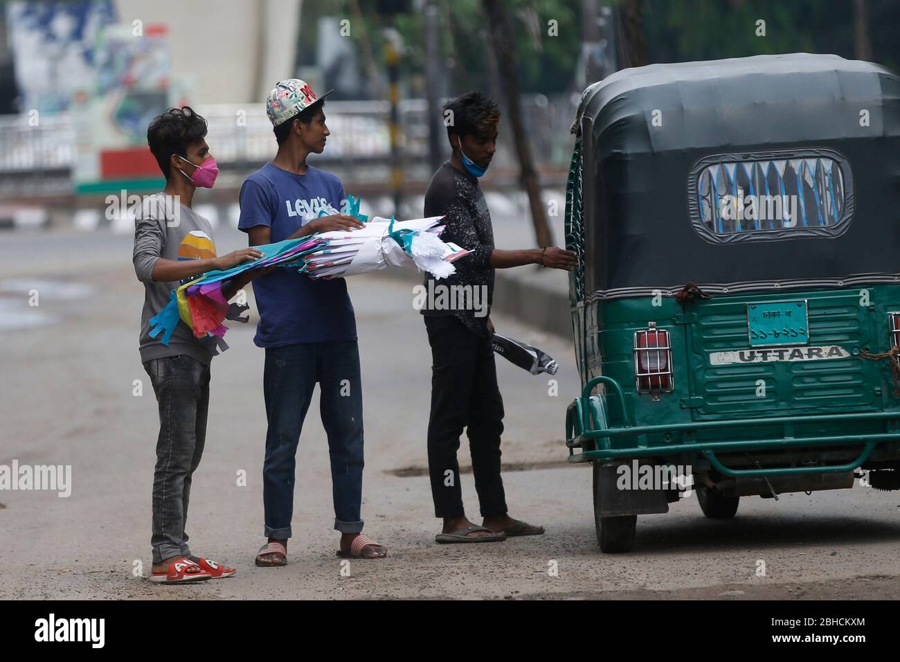 Three youths are spotted at Gulistan in Dhaka getting into a CNG-run ...