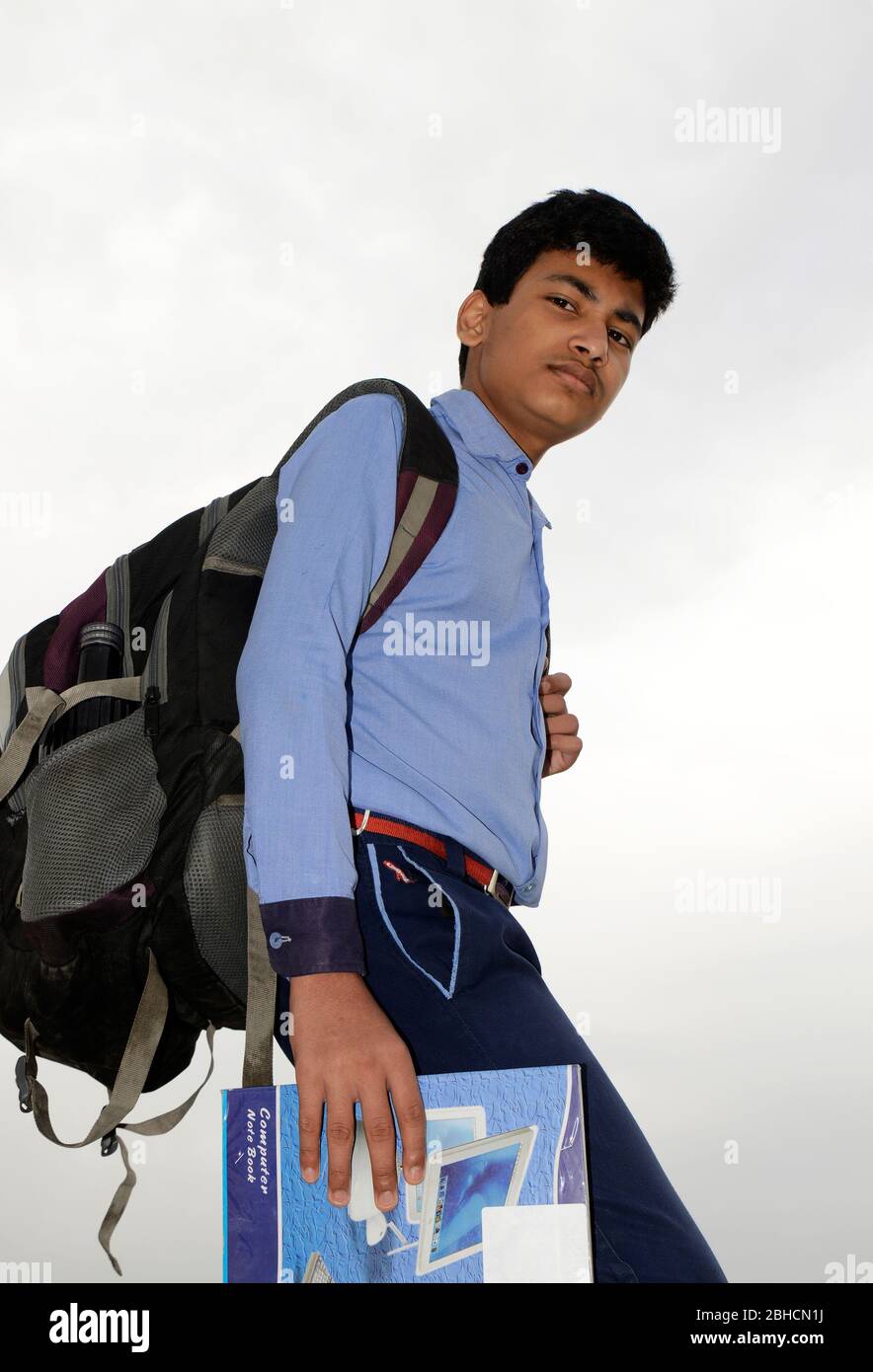 School boy wearing uniform and bag Stock Photo - Alamy