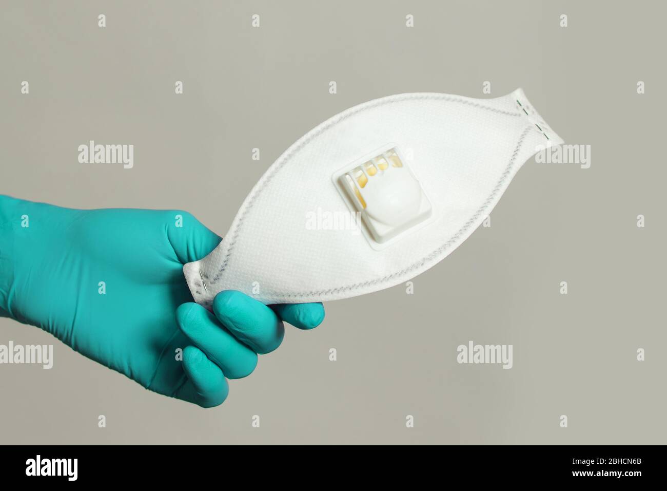 Medical filtering face piece mask in doctor or nurse hand, safety and ...