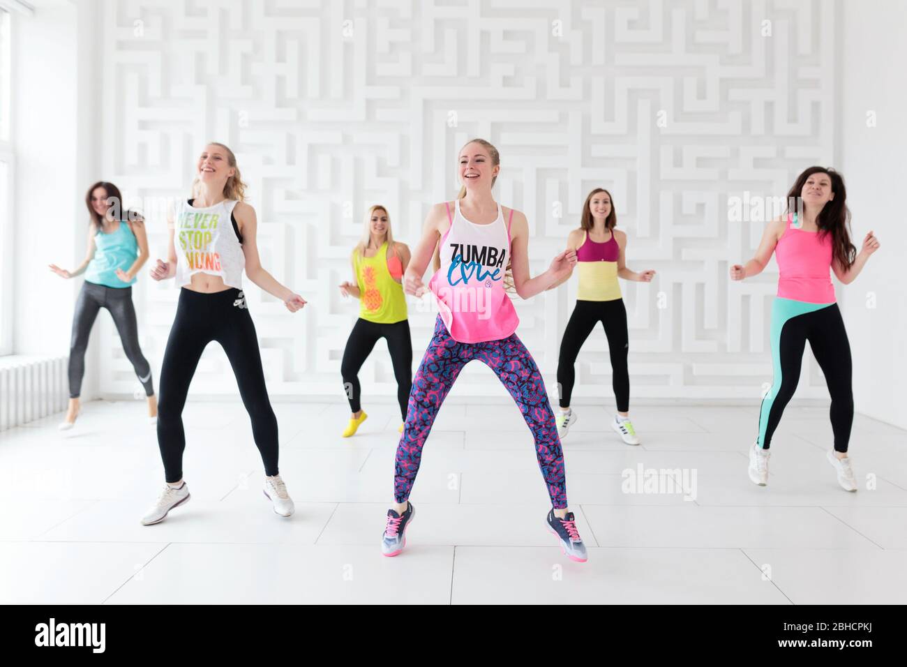 Young women wearing sportswear dancing Stock Photo - Alamy