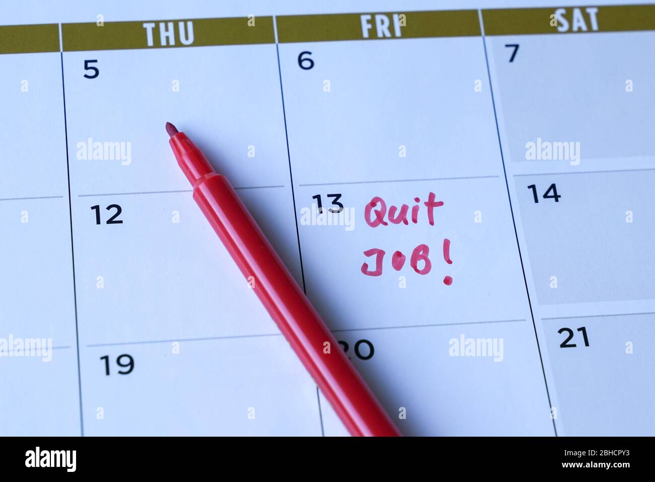 Quit job words written on table calendar with red marker. Employment or ...
