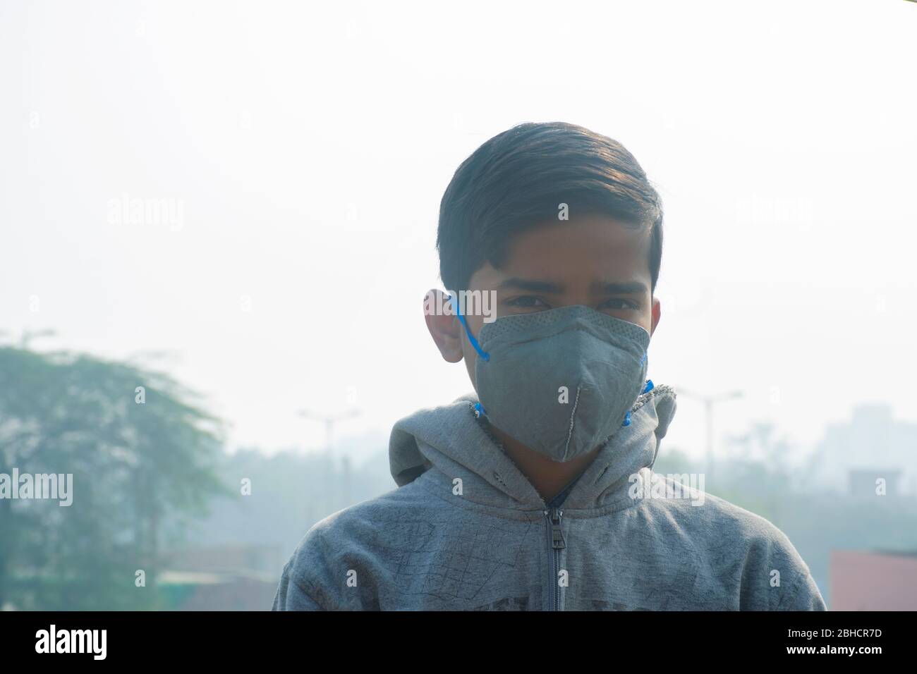 Boy wearing protection mask, India Stock Photo - Alamy
