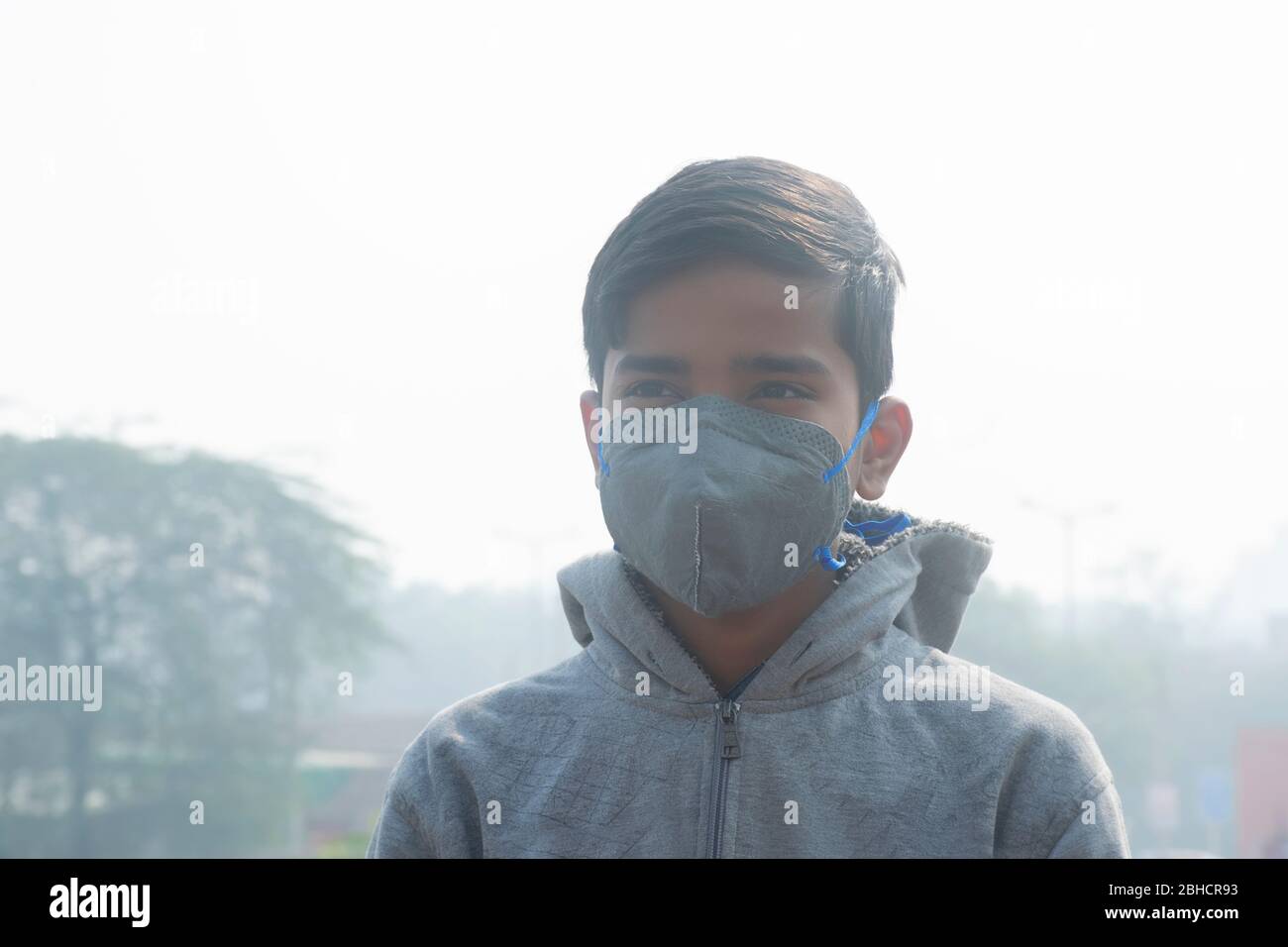 Boy wearing protection mask, India Stock Photo - Alamy