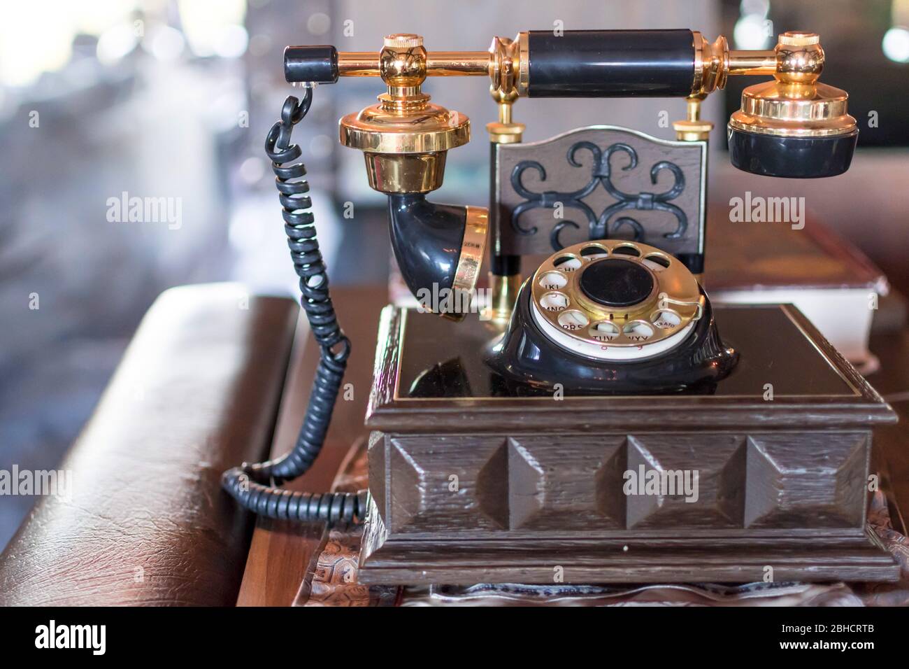 Vintage wooden telephone. Old fashion telephone Stock Photo - Alamy