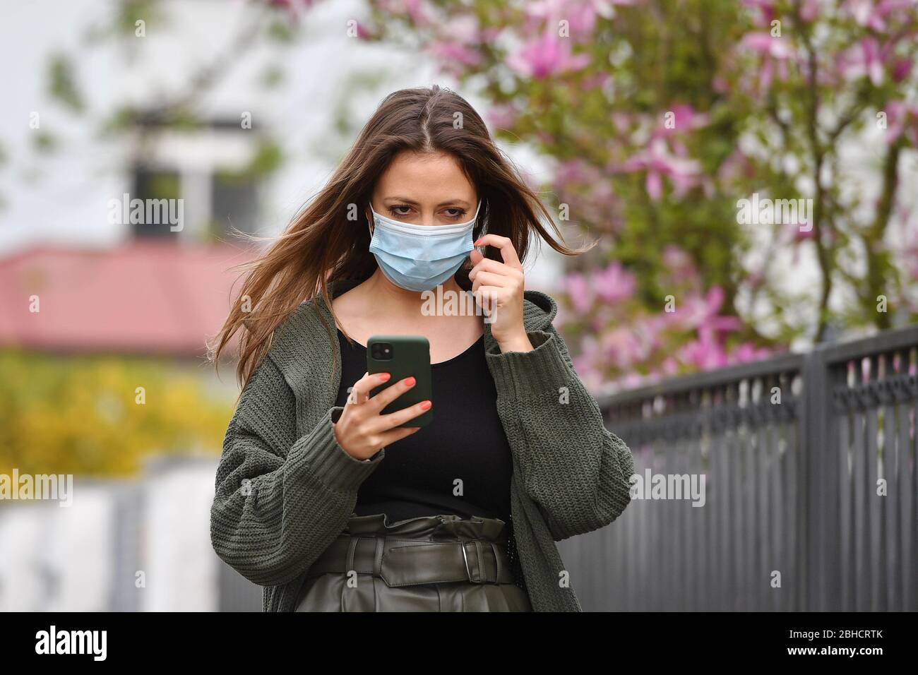 Topic image Corona: A young woman with protective mask, face mask ...