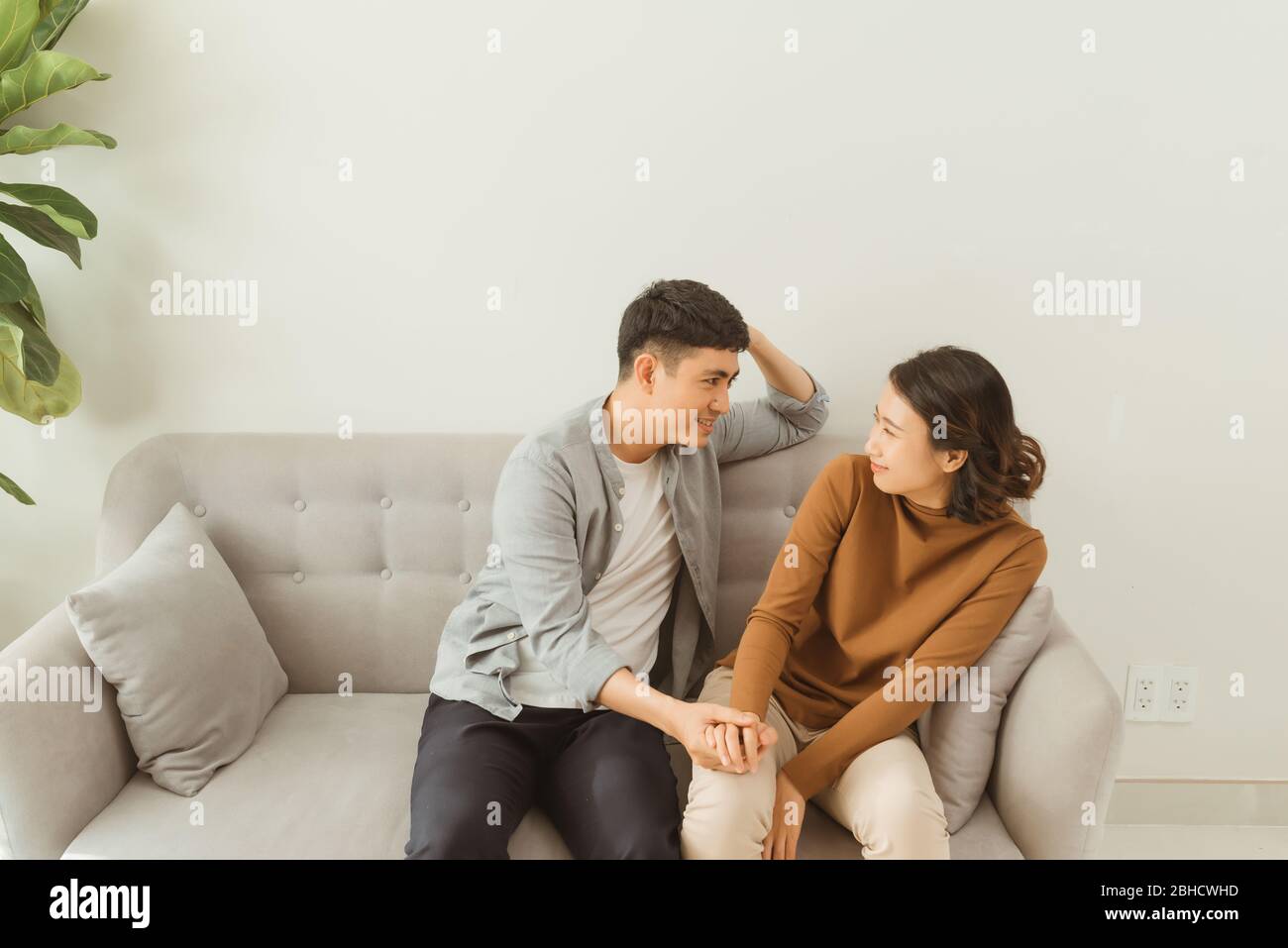 Woman is sad and depressed, her man is consoling her Stock Photo - Alamy