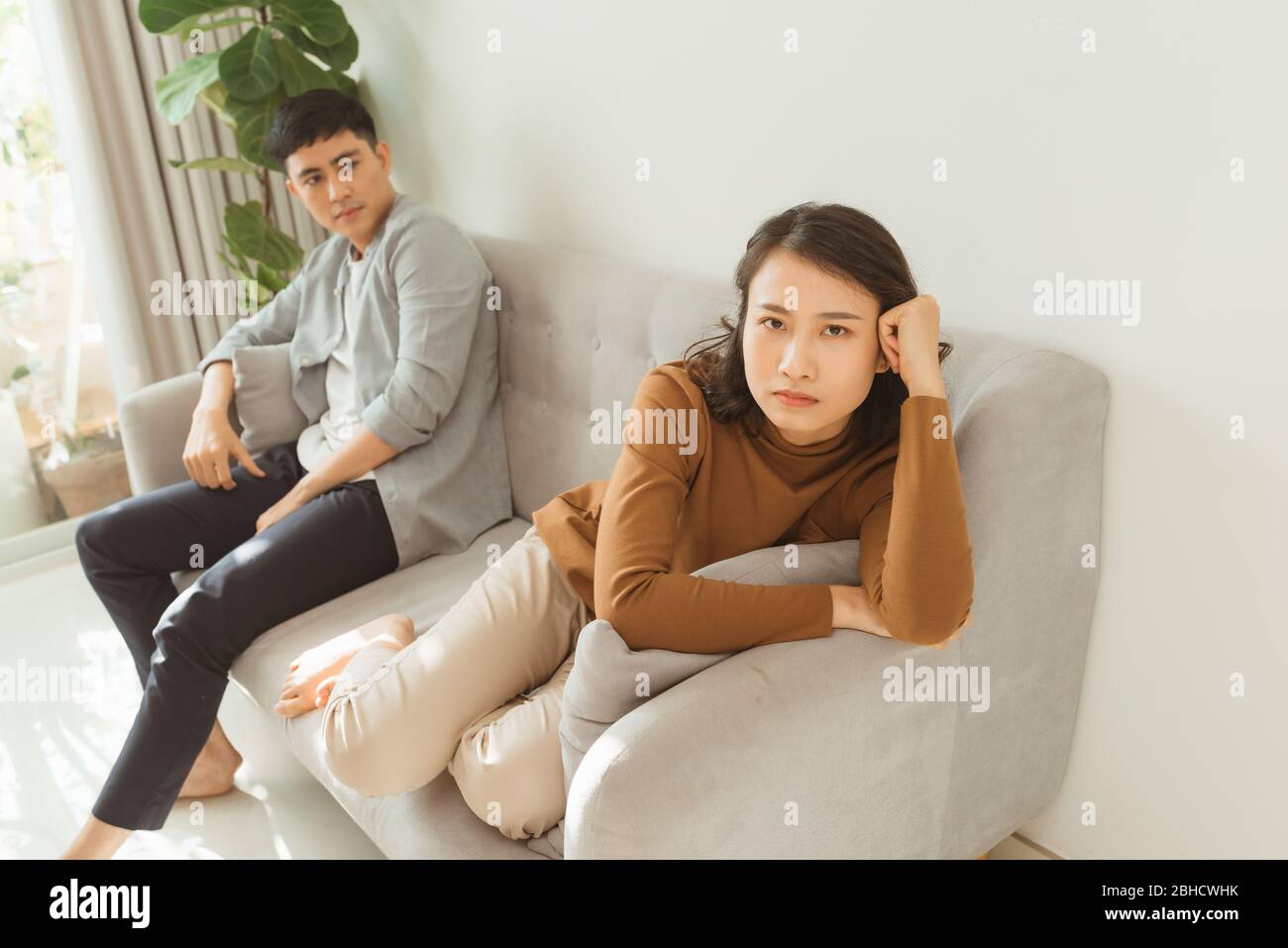 Upset Couple At Home Handsome Man And Beautiful Young Woman Are Having