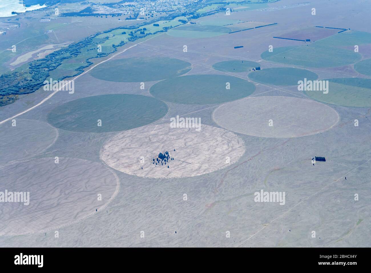 aerial, from a glider, of round fields pattern in barren country, shot ...