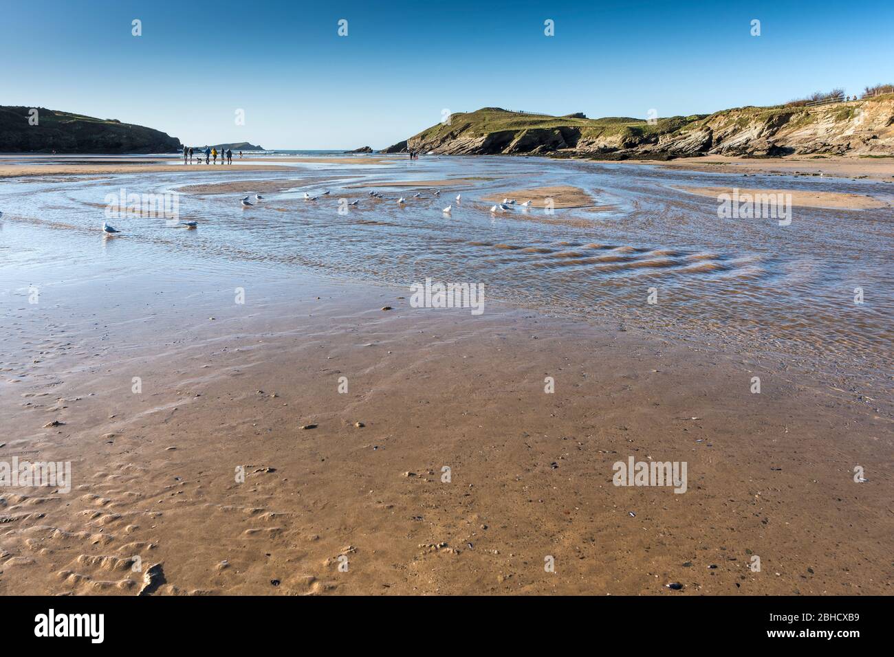 Low tide at Porth Beach in Newquay in Cornwall.Low tide at Porth Beach ...