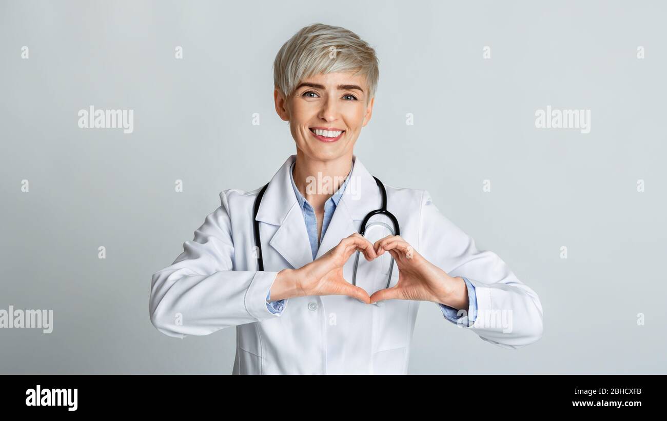 Doctor hands heart hi-res stock photography and images - Alamy