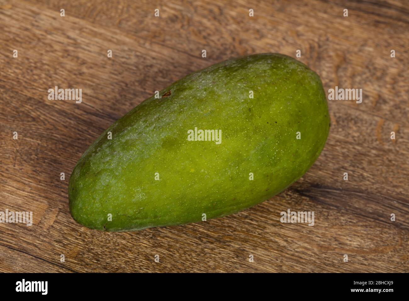 Green tasty mango over background Stock Photo - Alamy