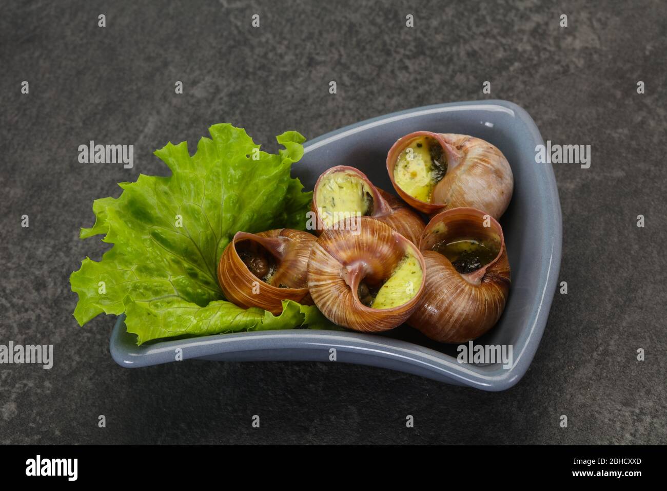 French cuisine - Escargot with butter sauce Stock Photo - Alamy