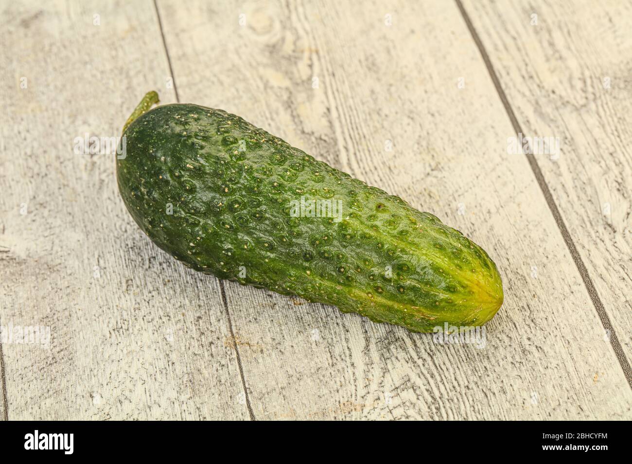 Green ripe fresh one cucumber over background Stock Photo - Alamy