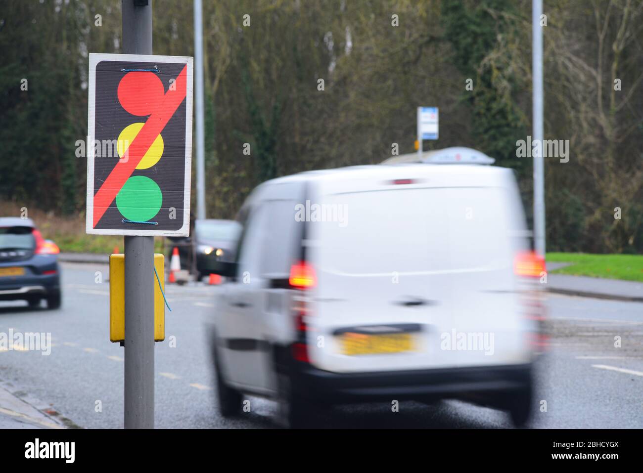 traffic passing warning sign of broken traffic lights at road junction ...