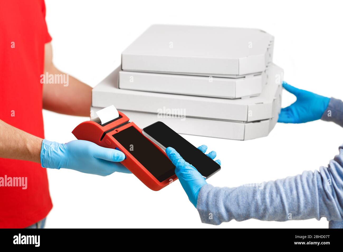 Courier delivery pizza. Client pays for service using smartphone Stock ...