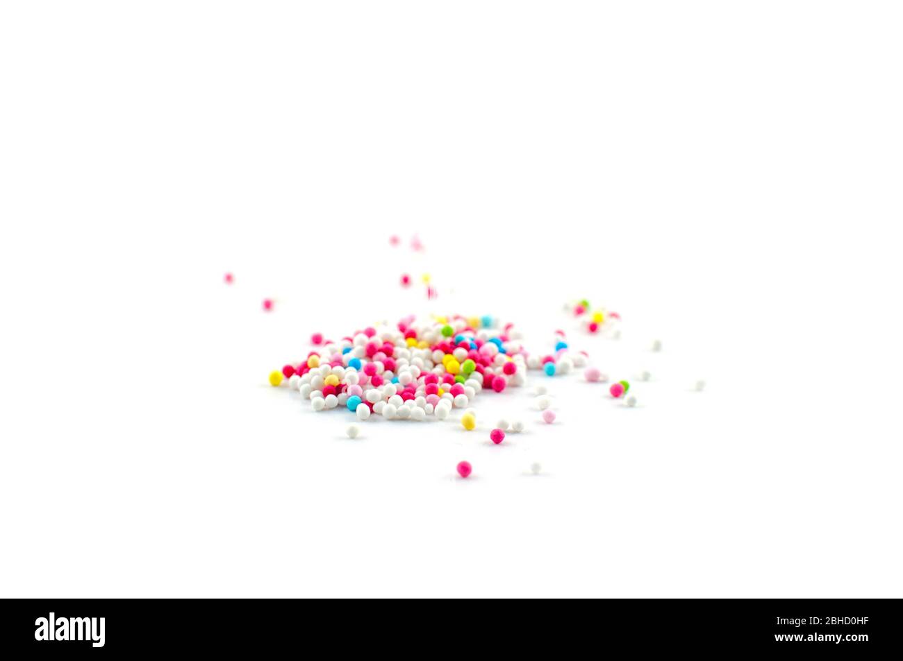 A bunch of colorful sugar pearls isolated on white background Stock ...