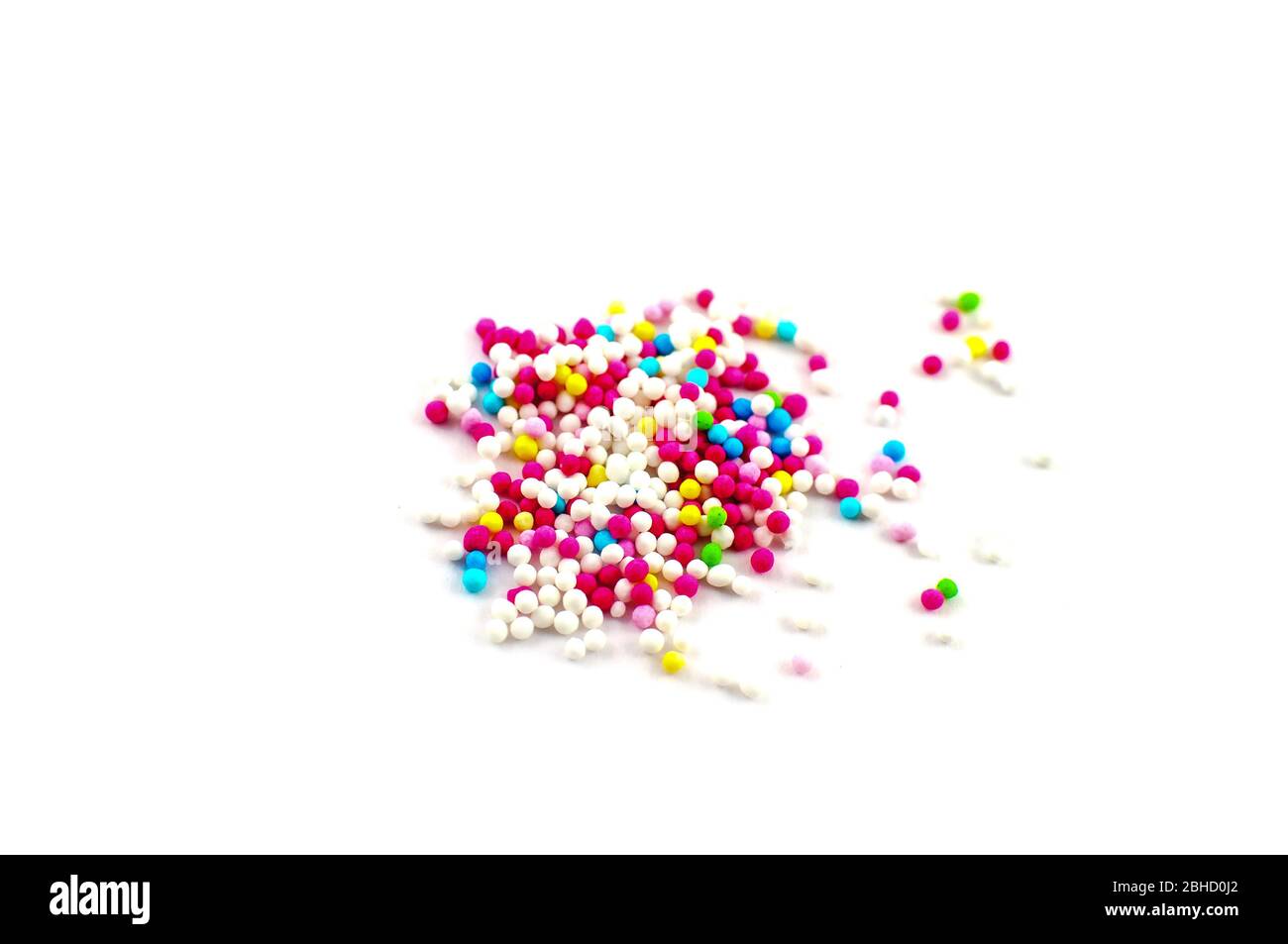 A bunch of colorful sugar pearls isolated on white background Stock ...