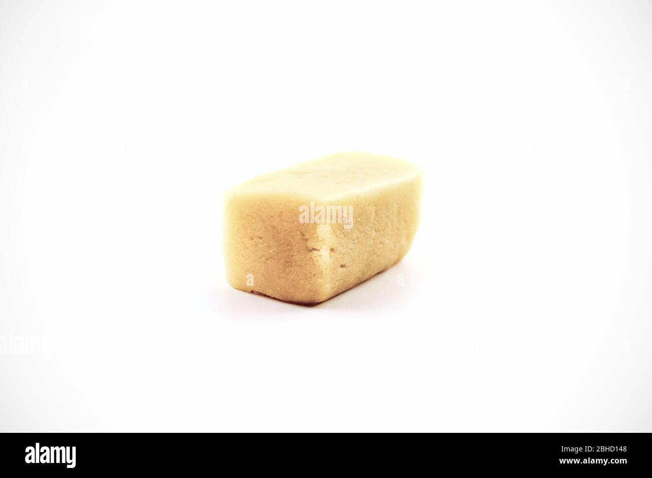 Raw Marzipan block isolated on white background Stock Photo - Alamy