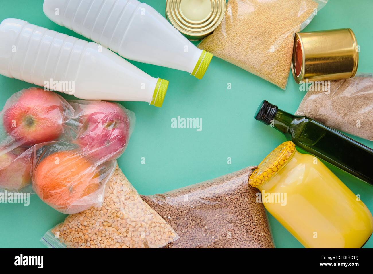 Donation food during quarantine, different products on a blue ...