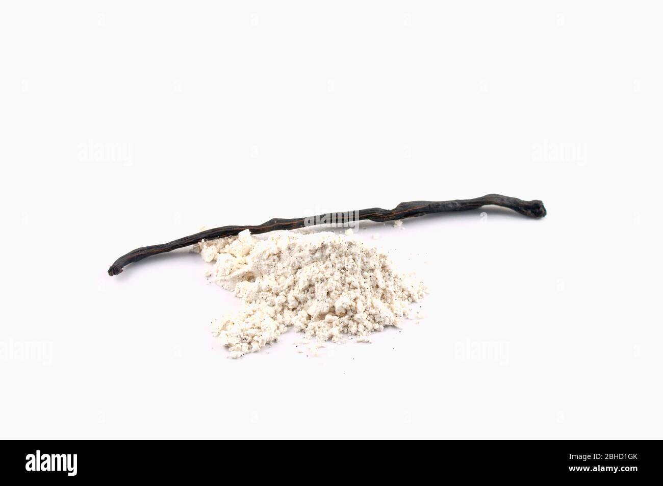 Vanilla pod with powder on white background Stock Photo - Alamy