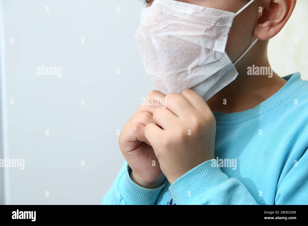 Sick Child wearing surgical mask coughing . Kids wear health masks to ...
