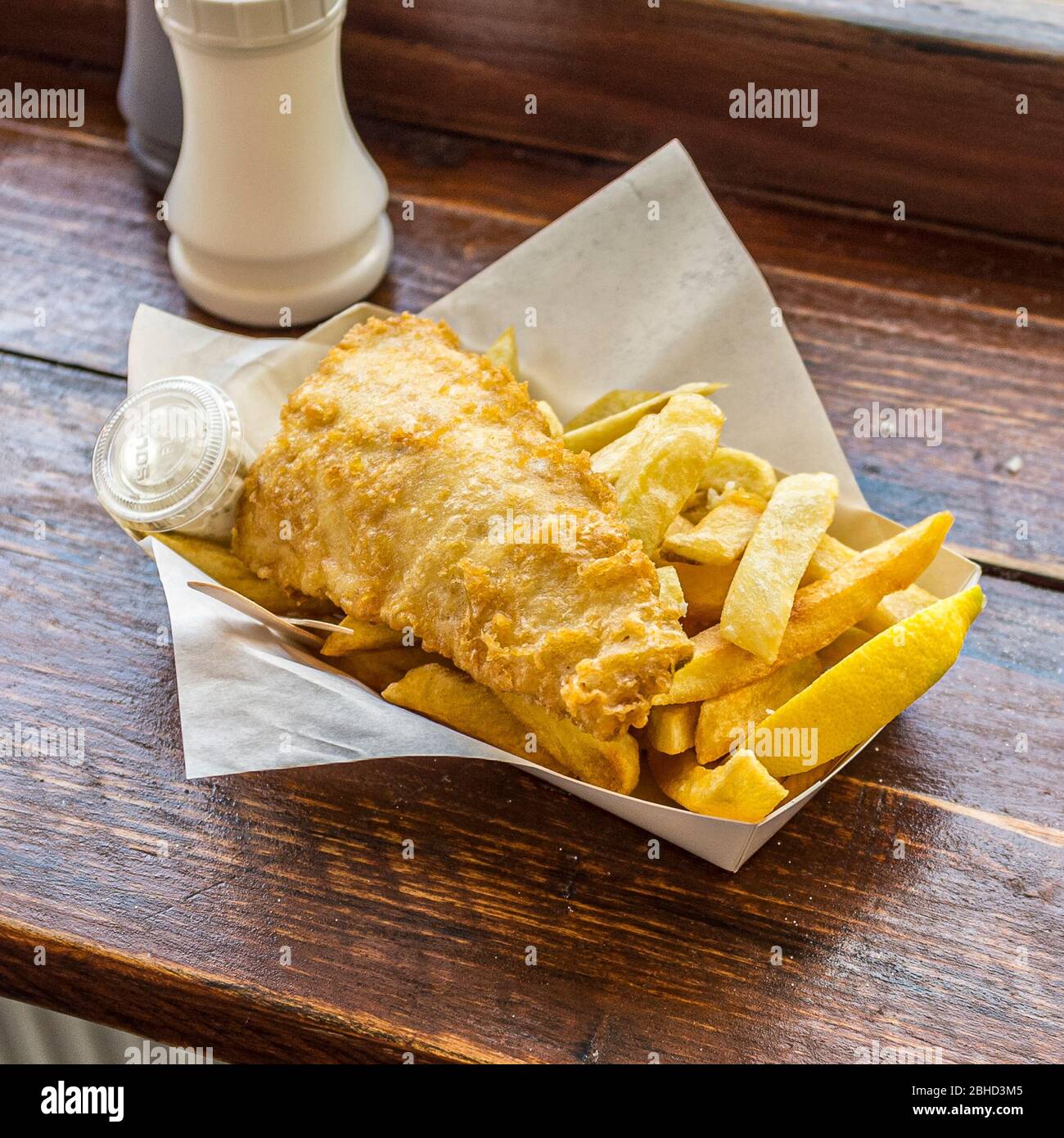 Fish and Chips and a tub of tartar sauce, in Devon, England Stock Photo ...