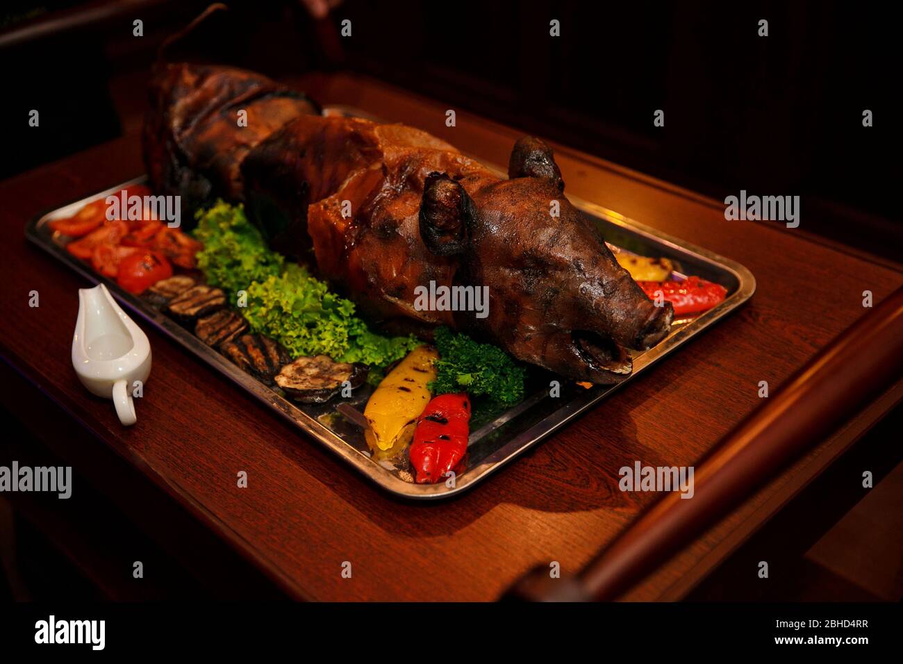 young roasted piggy pig being served at the celebration Stock Photo - Alamy