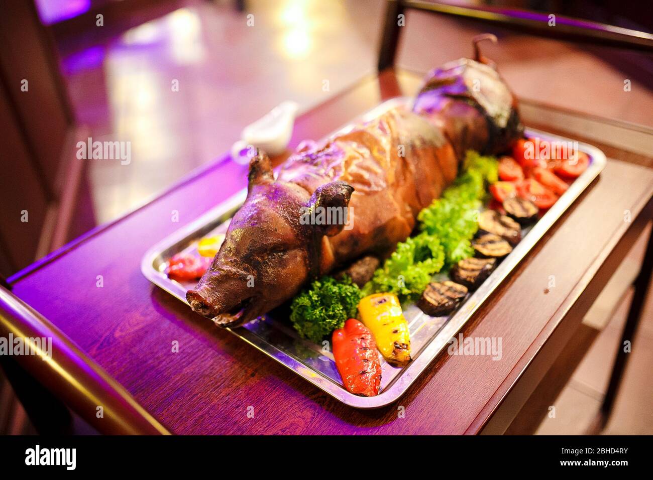 young roasted piggy pig being served at the celebration Stock Photo - Alamy