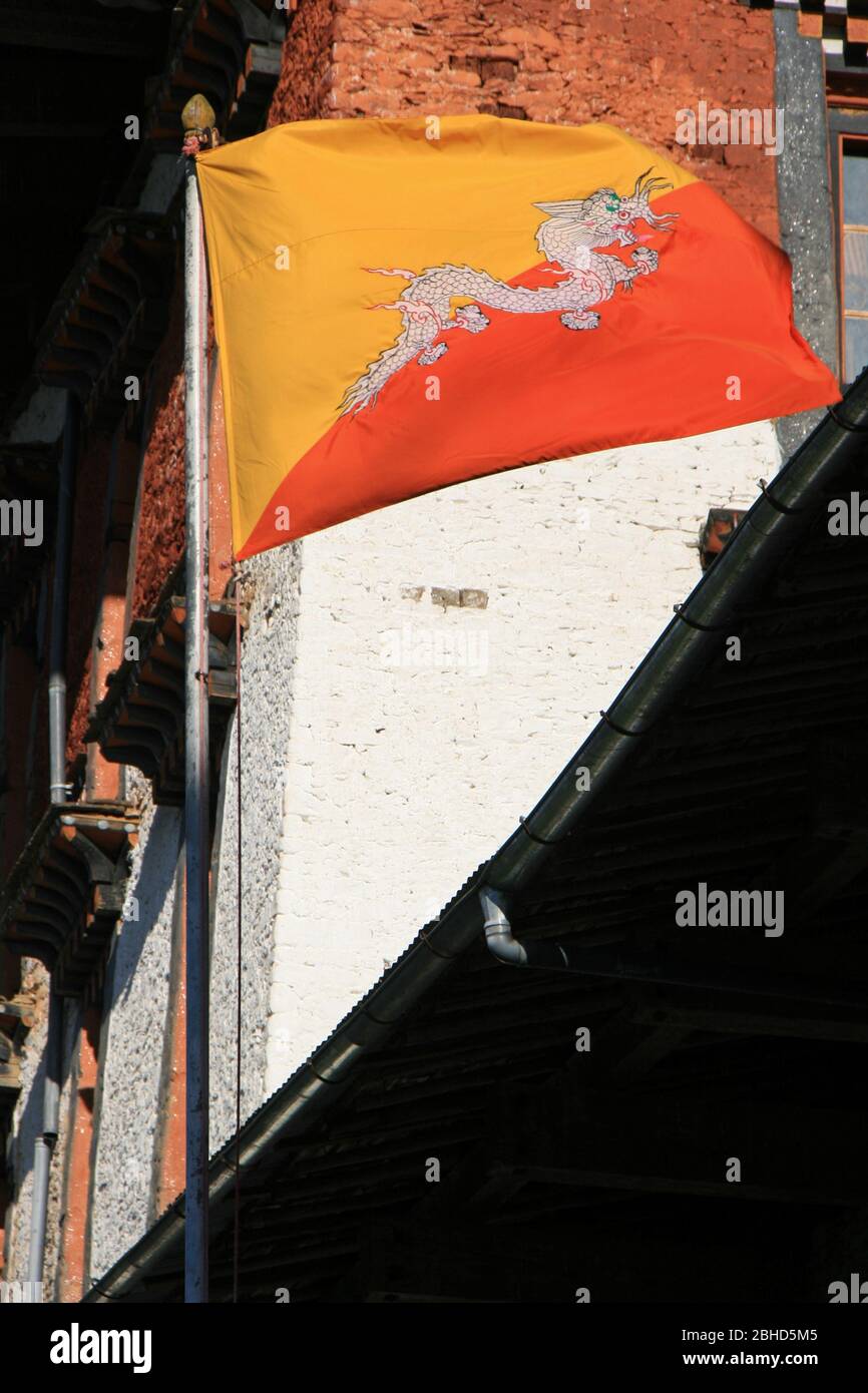 bhutanese flag in bhutan Stock Photo - Alamy