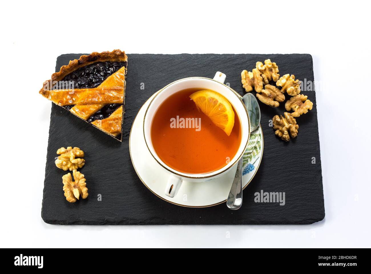 Drinking tea with nut pie Stock Photo - Alamy