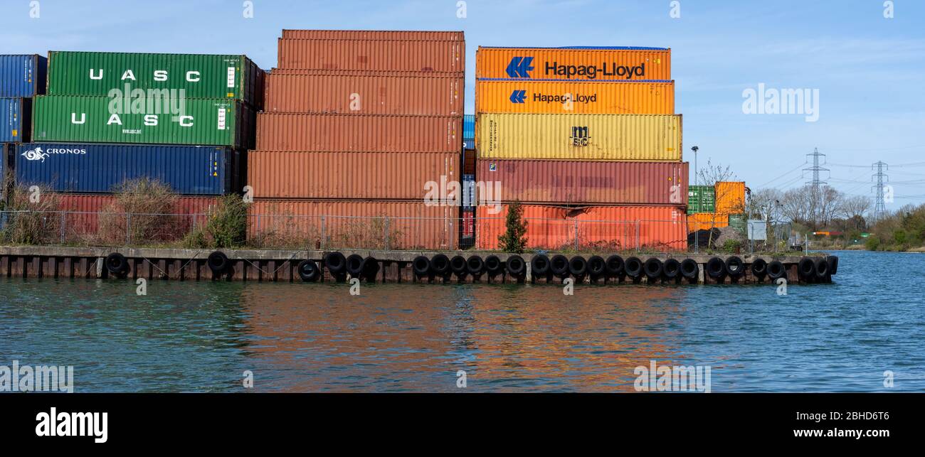 Shipping containers stacked high at Eling Wharf, Totton, Hampshire ...