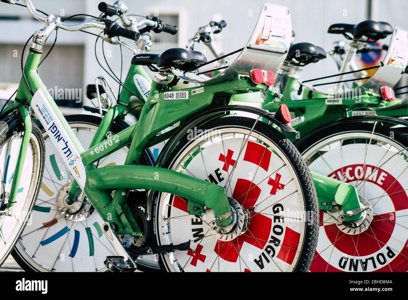 Tel Aviv Israel June 10, 2019 View of green electric bicycles to hire ...