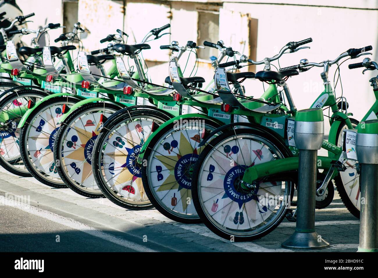 Tel Aviv Israel June 10, 2019 View of green electric bicycles to hire ...