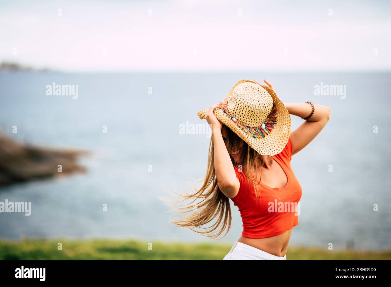 Happiness concept with cheerful and joyful girl dance outdoor with red ...