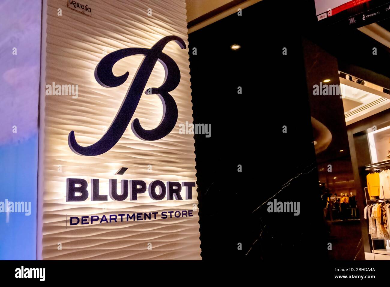 The Blueport department store logo on the wall at night which is the ...