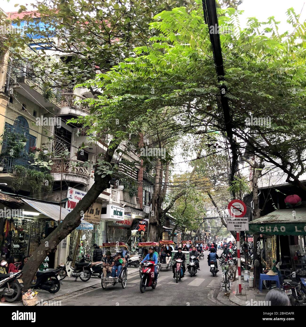 Hanoi, Vietnam, December 30, 2019, Tourists and bikers on a street of ...