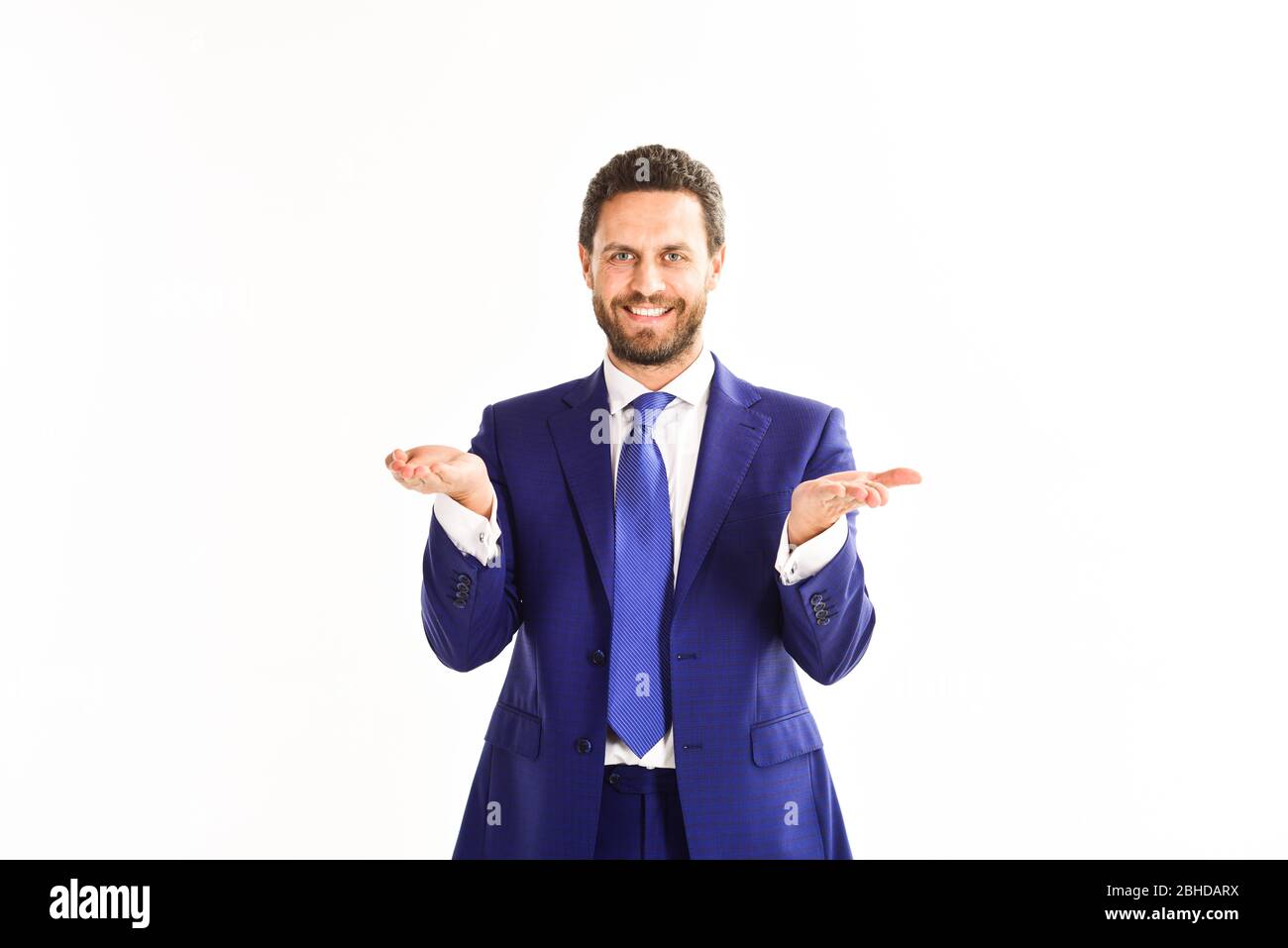 Businessman presenting something on his open palms. Man in suit or ...