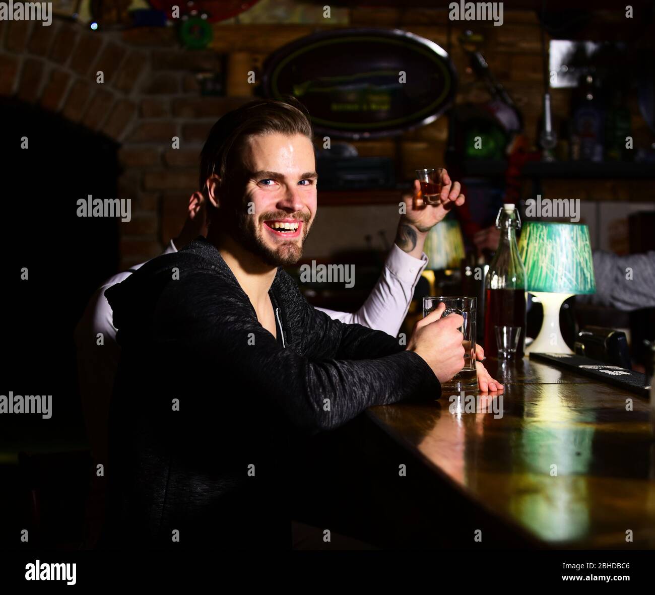 Men drink beer and shot or liqueur in bar. Celebration and fun concept ...